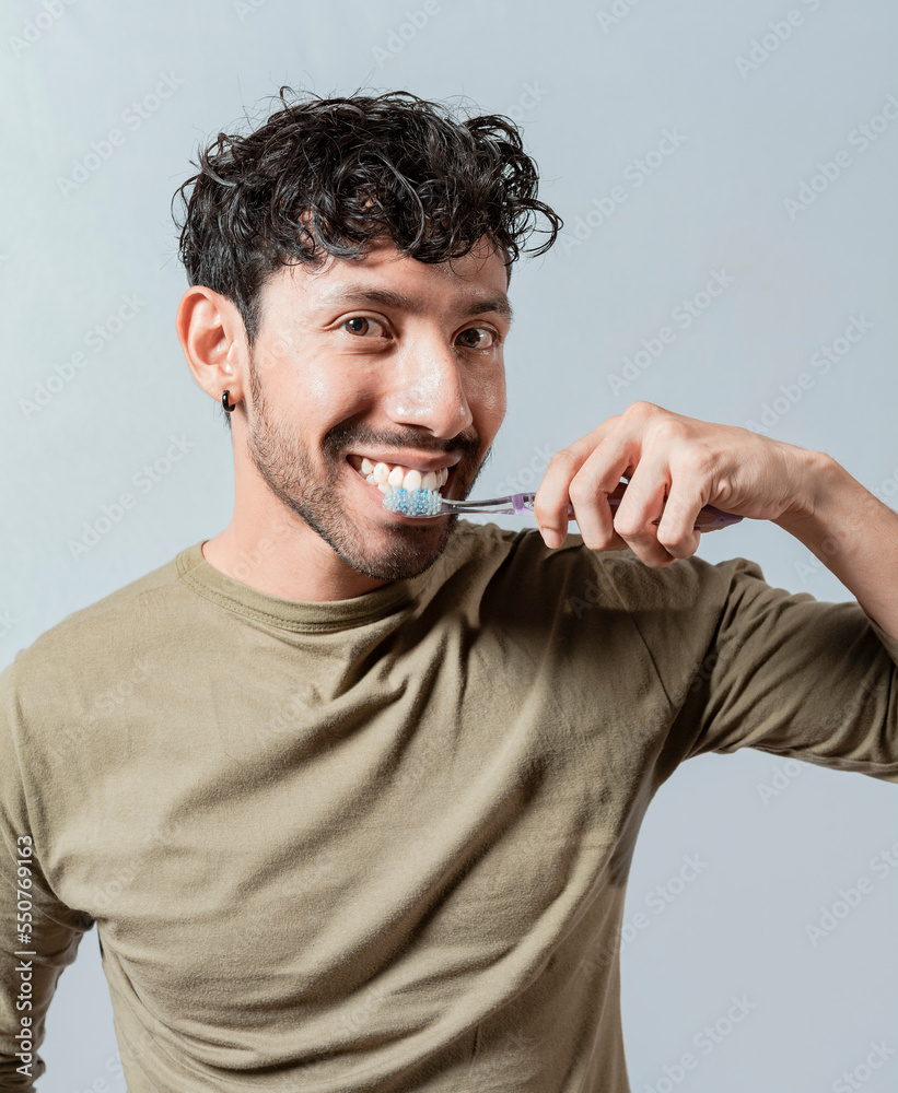 Smiling man brushing his teeth isolated, Face of handsome man brushing ...