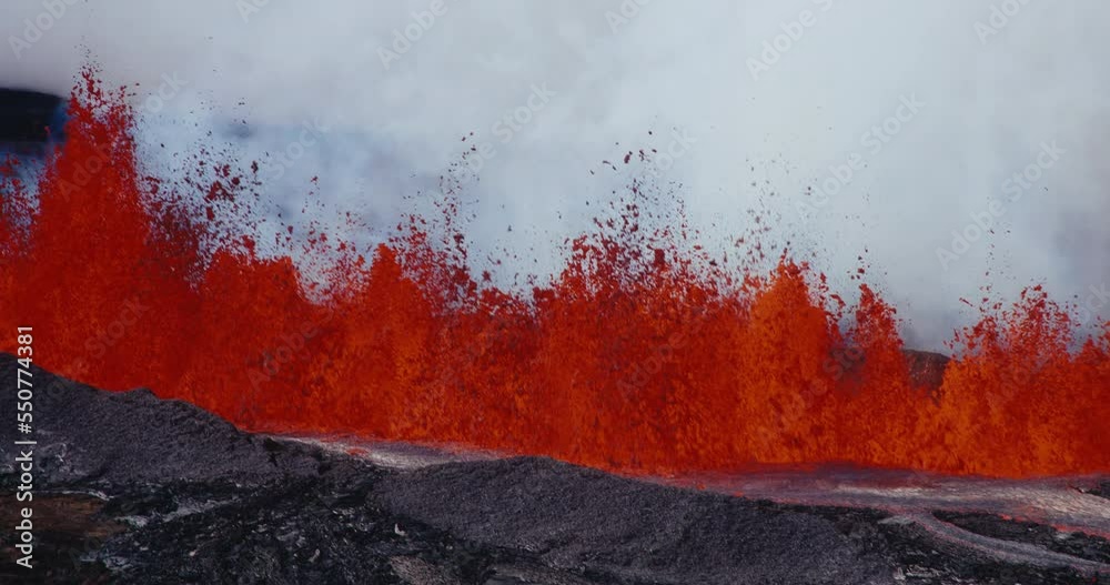Volcano erupting, lava fountain shooting up into the air from the ...