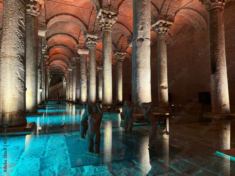 Statues of four men and columns in water in the restored Basilica ...