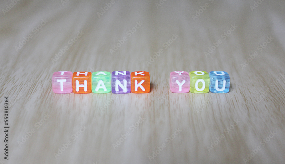 Thank you- word made from multicolored child toy cubes with letters ...