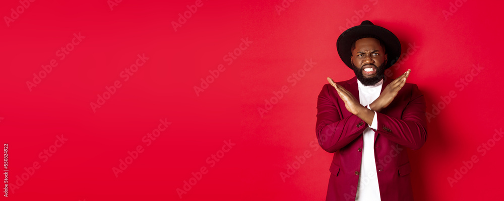 Angry Black man showing cross to stop something, looking furious and ...