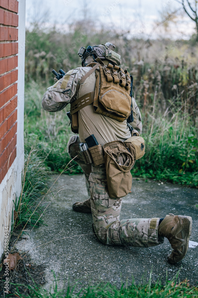 Special forces operator in Multicam uniform perform CQB tactics ...