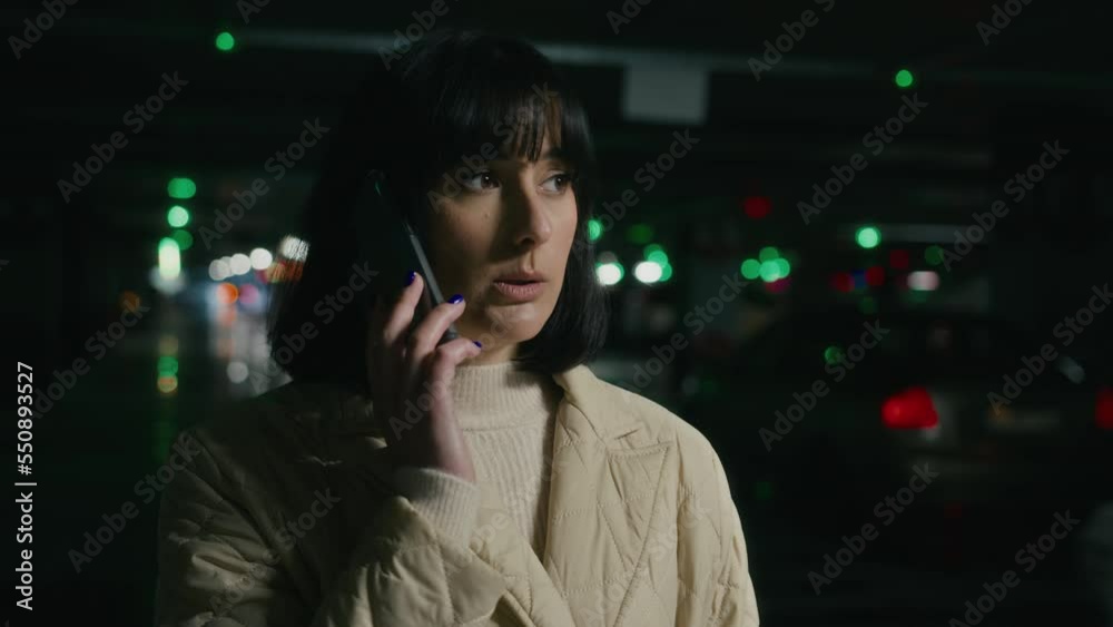 Sad businesswoman talking phone in parking lot upset woman has business ...