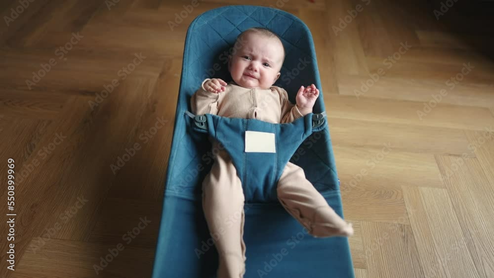newborn baby in a rocking chair. happy family kid dream concept ...