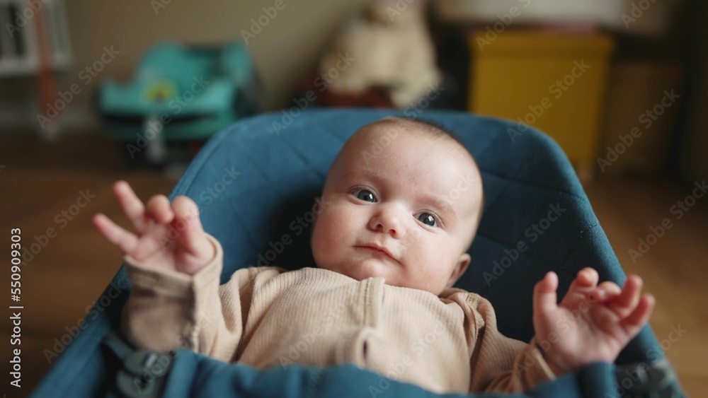 newborn baby in a rocking chair. happy family kid dream concept ...