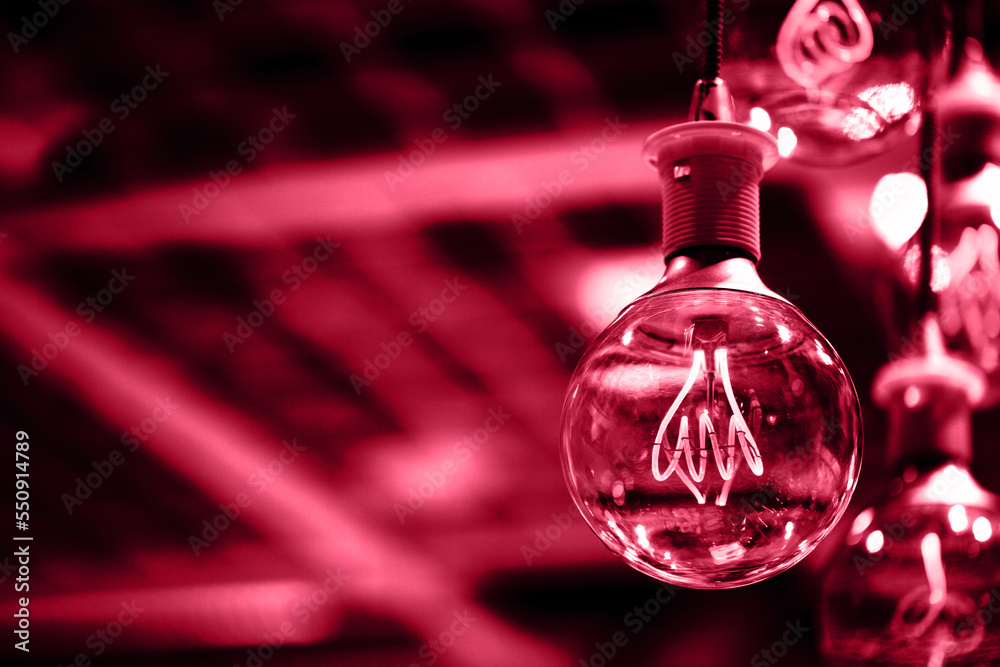 Group of red lamps with interesting shape of tungsten filament ...