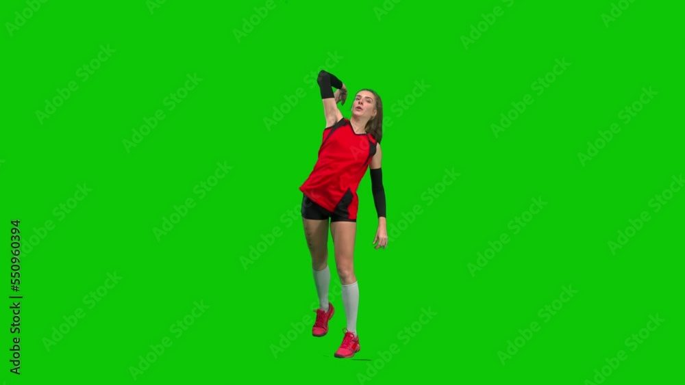 Young female athlete throwing up virtual ball and hitting it with her ...