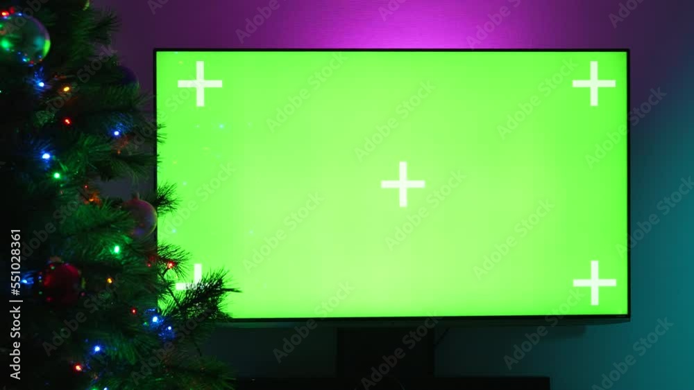 LCD TV With Track Green Screen. Glowing Christmas Tree In The ...