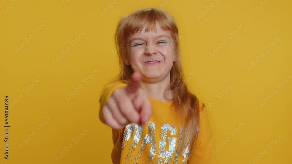 Amused young preteen child girl kid pointing finger to camera, laughing ...
