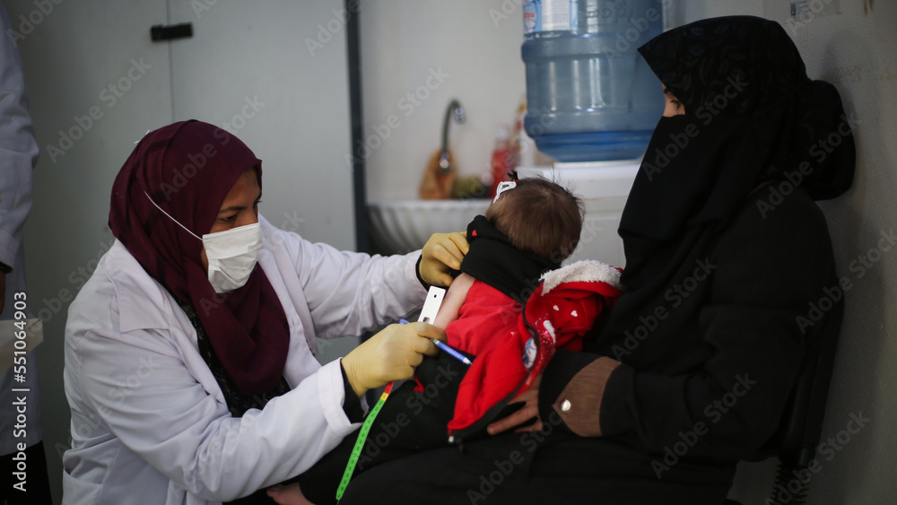 Doctor examines child malnutrition. Measuring malnutrition using strap ...