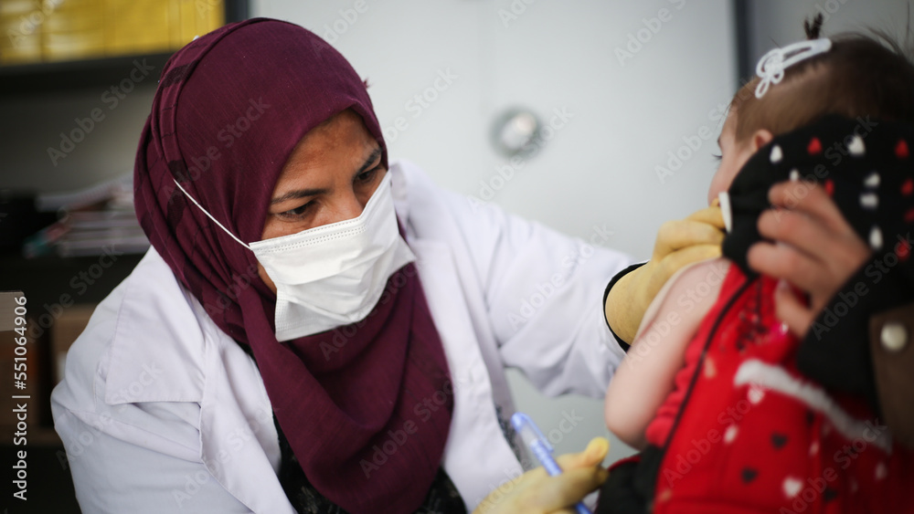 Doctor examines child malnutrition. Measuring malnutrition using strap ...