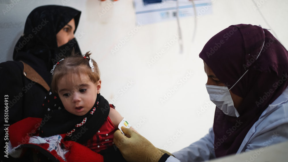 Doctor examines child malnutrition. Measuring malnutrition using strap ...