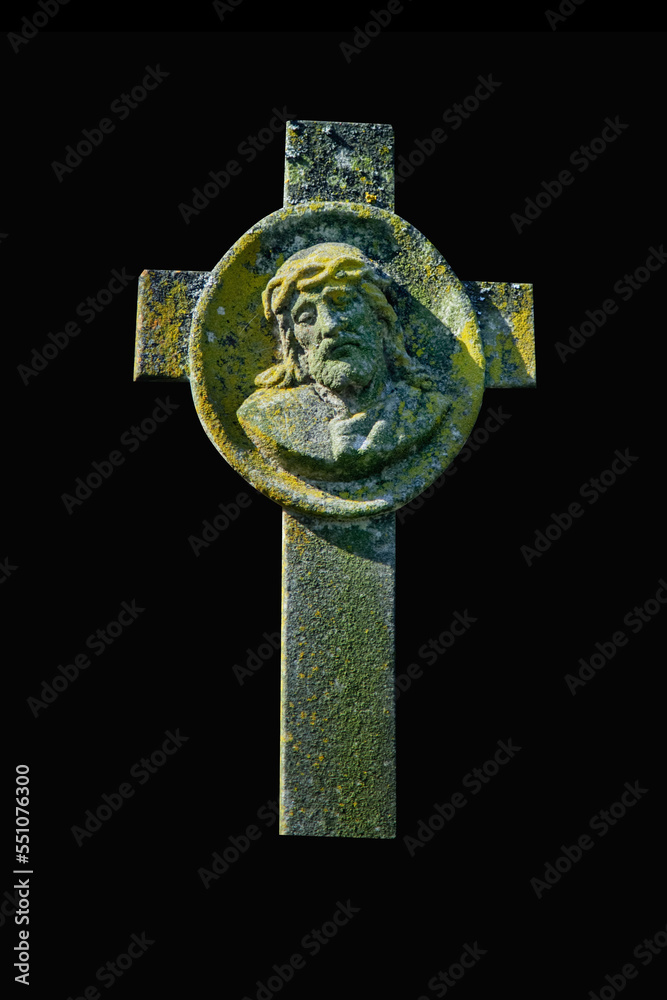Holy cross with crucified Jesus Christ. Ancient statue anainst black ...