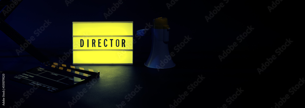 Director chair with cinema lightbox sign Director text on it and ...
