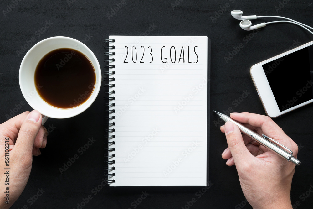 Notebook with 2023 goals text on it to apply new year resolutions and ...