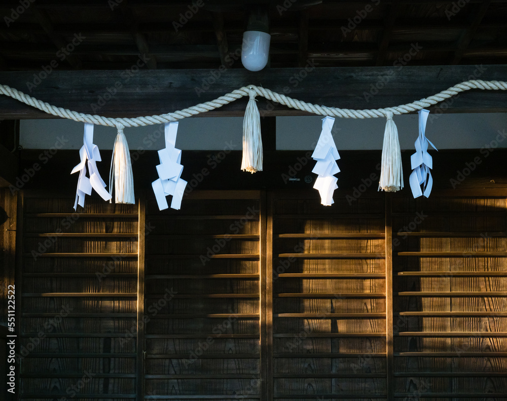 Shimenawa rope with shide paper streamers adorning a Japanese shinto ...