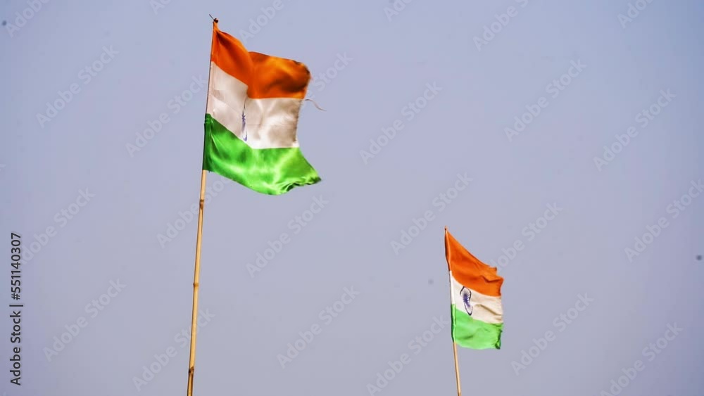slow motion of two Indian tri color with saffron green white and ashoka ...