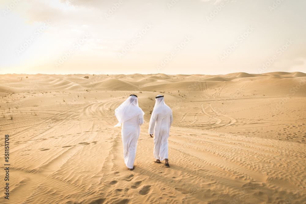Arab men wearing typical middle eastern clothing in the desert Stock ...