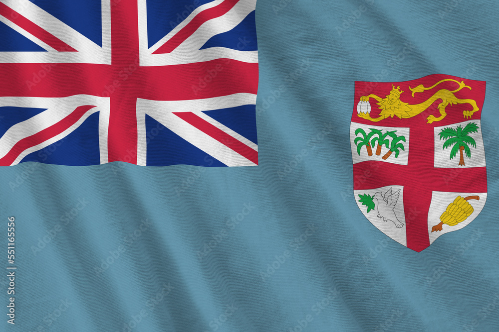 Fiji flag with big folds waving close up under the studio light indoors ...