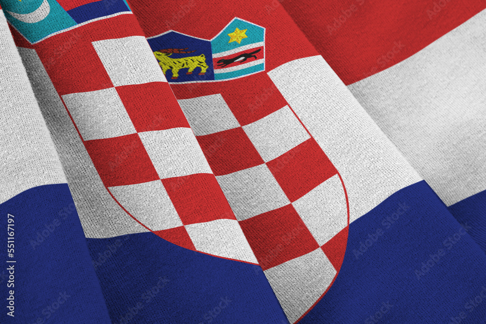Croatia flag with big folds waving close up under the studio light ...