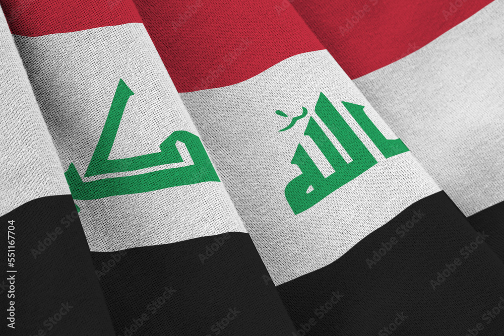 Iraq flag with big folds waving close up under the studio light indoors ...