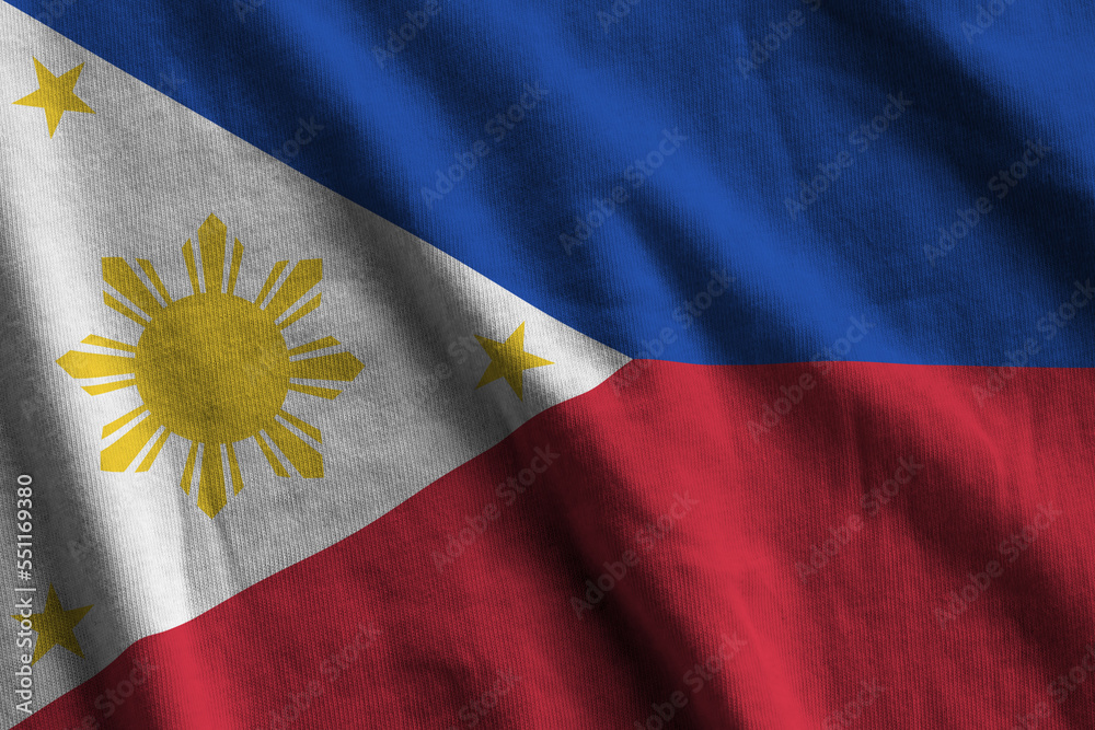 Philippines flag with big folds waving close up under the studio light ...
