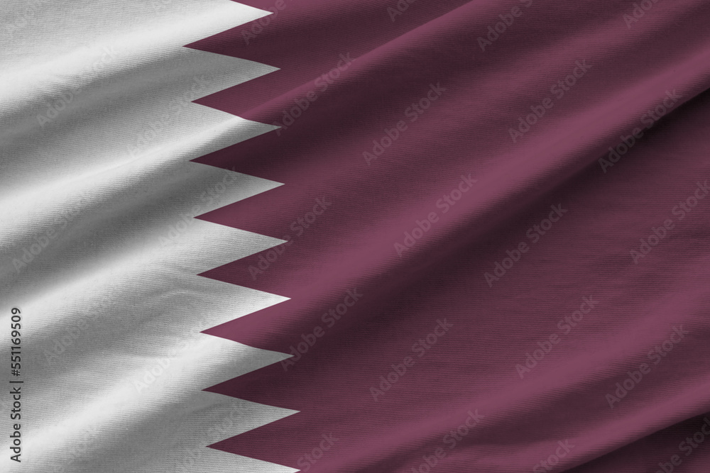 Qatar flag with big folds waving close up under the studio light ...