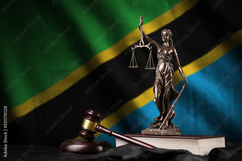 Tanzania flag with statue of lady justice, constitution and judge ...