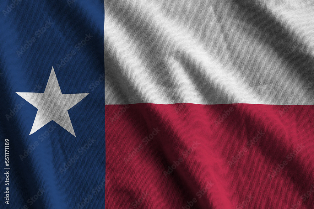 Texas US state flag with big folds waving close up under the studio ...