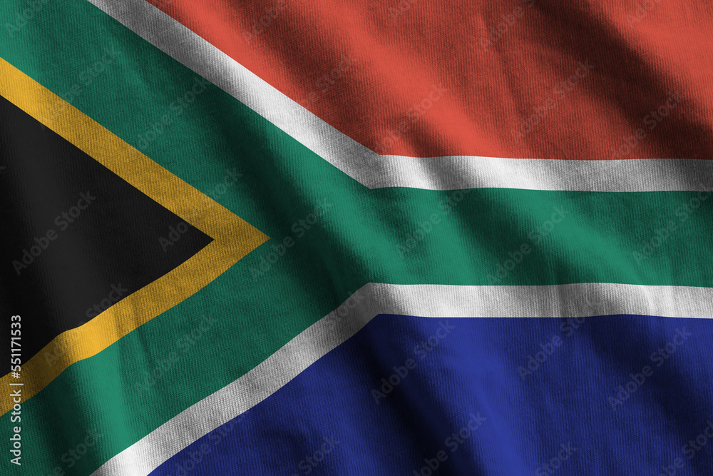 South Africa flag with big folds waving close up under the studio light ...