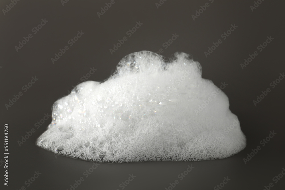 Fluffy bath foam on grey background, closeup Stock Photo | Adobe Stock