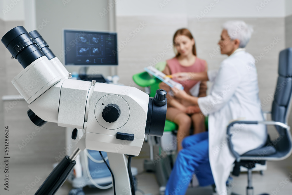 Close-up of colposcope, over background gynecological consultation of ...