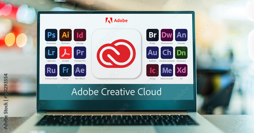 Laptop computer displaying logotypes of Adobe Creative Cloud Stock ...
