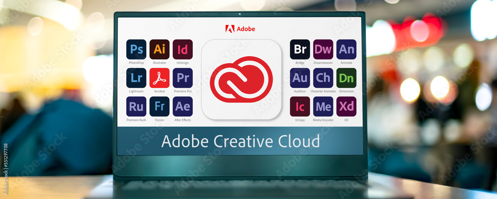 Laptop computer displaying logotypes of Adobe Creative Cloud Stock ...