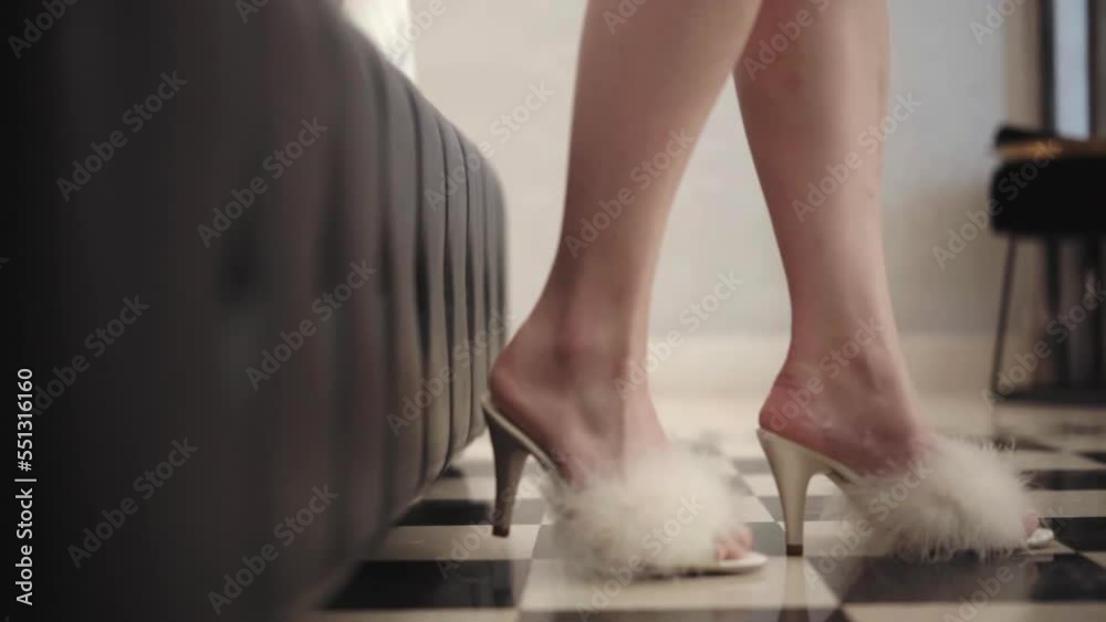 Side view shot of sexy woman legs and feet in beautiful fluffy wedding ...