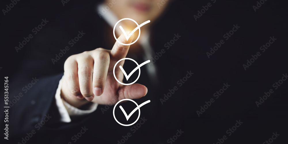 Checklist and Quality Assurance Concept. Businessman marks on check box ...
