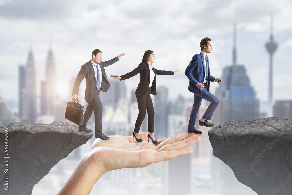 Creative image of team helping each other walk through obstacle on ...