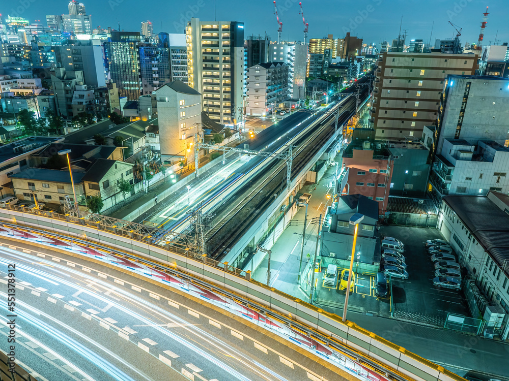 Japan architecture. Osaka city roads. Trestle over railroad. Evening ...