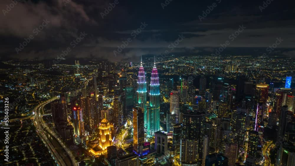 4K Aerial Hyperlapse of KLCC during night view. the colour of KLCC is ...