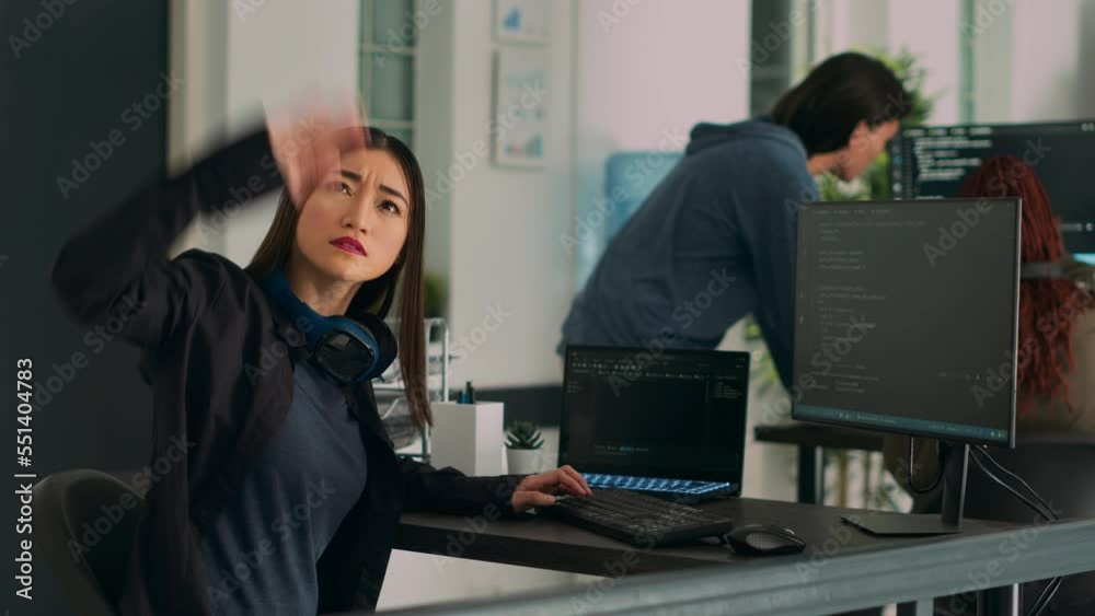 Asian Coder Turning Head To Work With Holographic Server Code Typing Html Script On Terminal