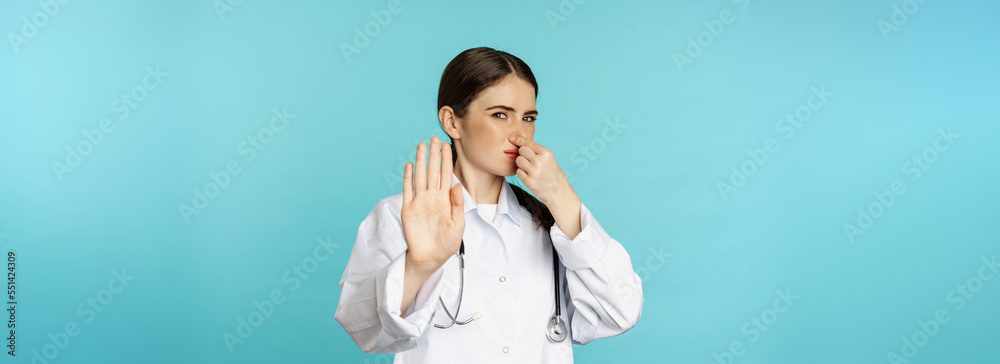 Woman doctor dislike, shut nose from bad smell, reek, showing rejection ...