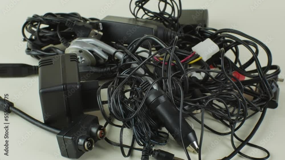 Pile of old wires, connections and chargers, isolated on light ...