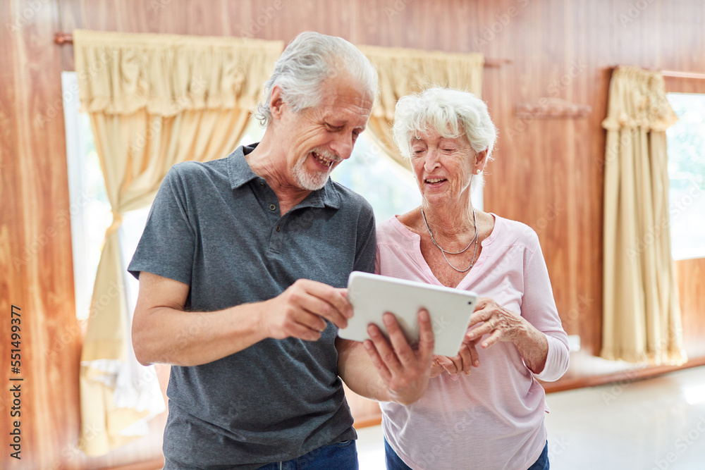 Curious senior couple with tablet computer Stock Photo | Adobe Stock