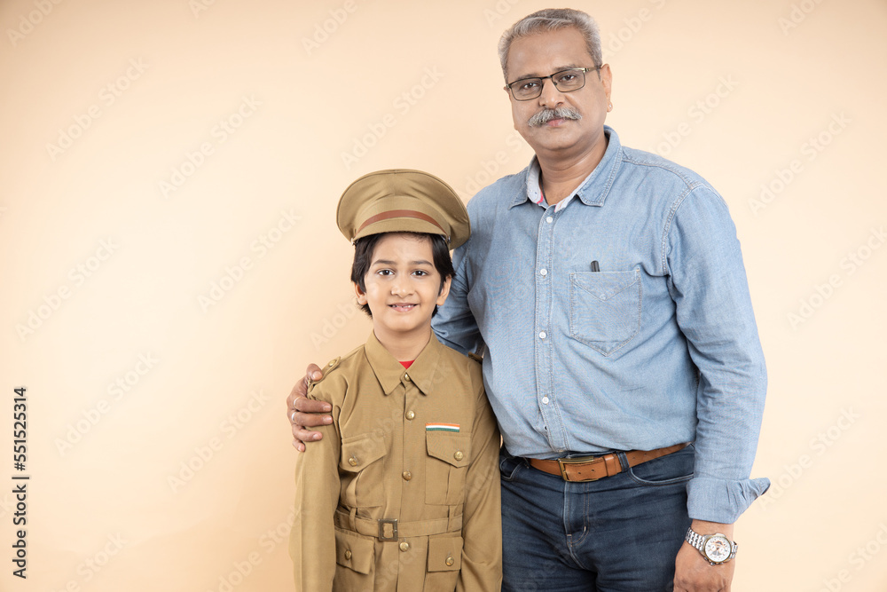 Happy indian kid wearing police uniform dress standing with his proud ...