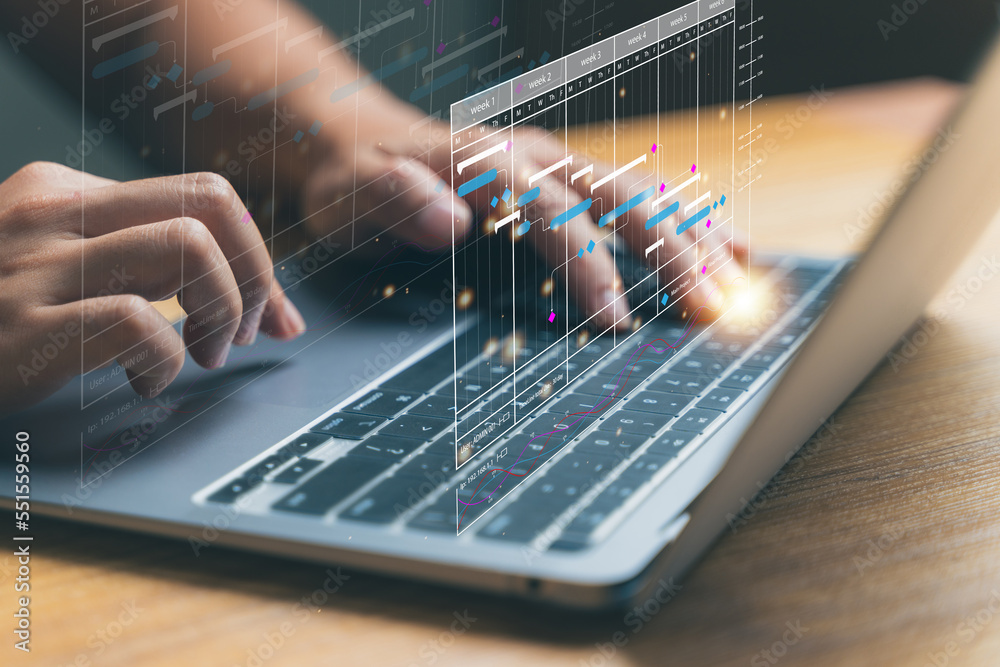 Man using laptop with timeline graph chart for project management ...