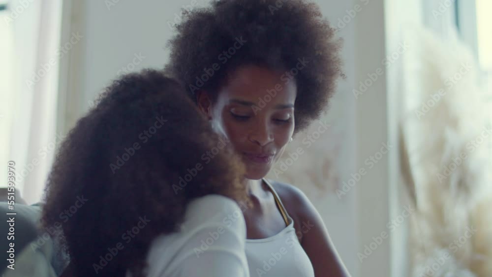 Young mum and child spending time at home, sitting and talking ...