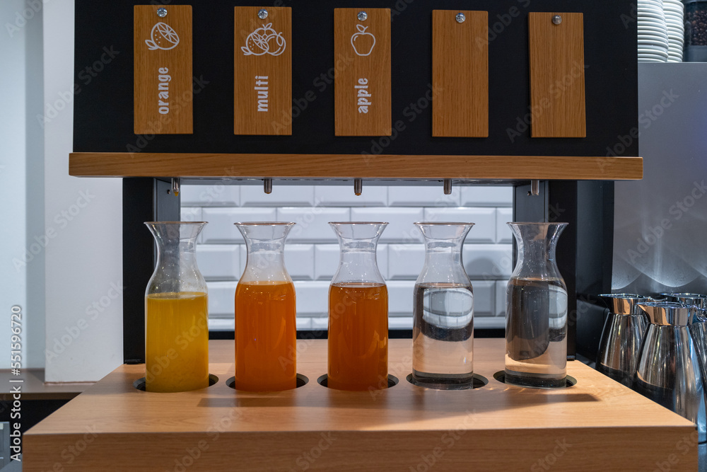 on a breakfast buffet there are different juices and water ready Stock ...