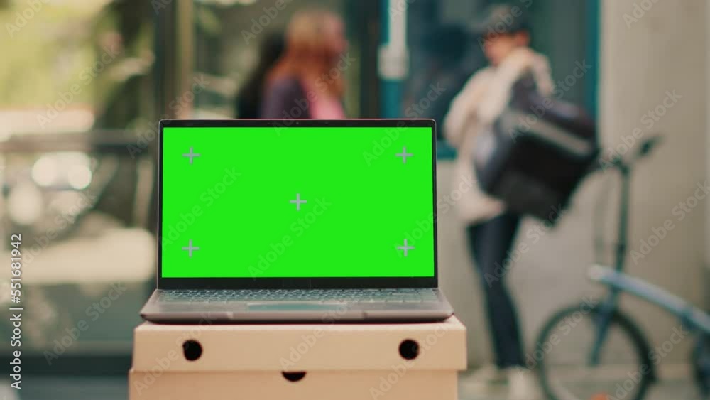 Laptop advertising greenscreen template outside, food delivery service ...