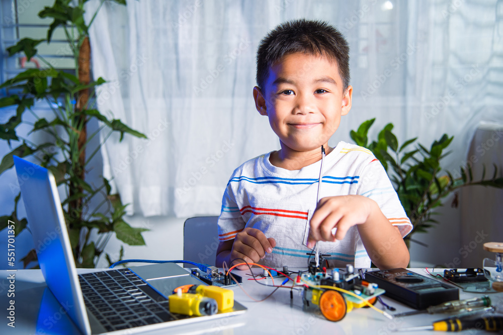 Little child remotely learn online with car toy before sent code, Asian ...