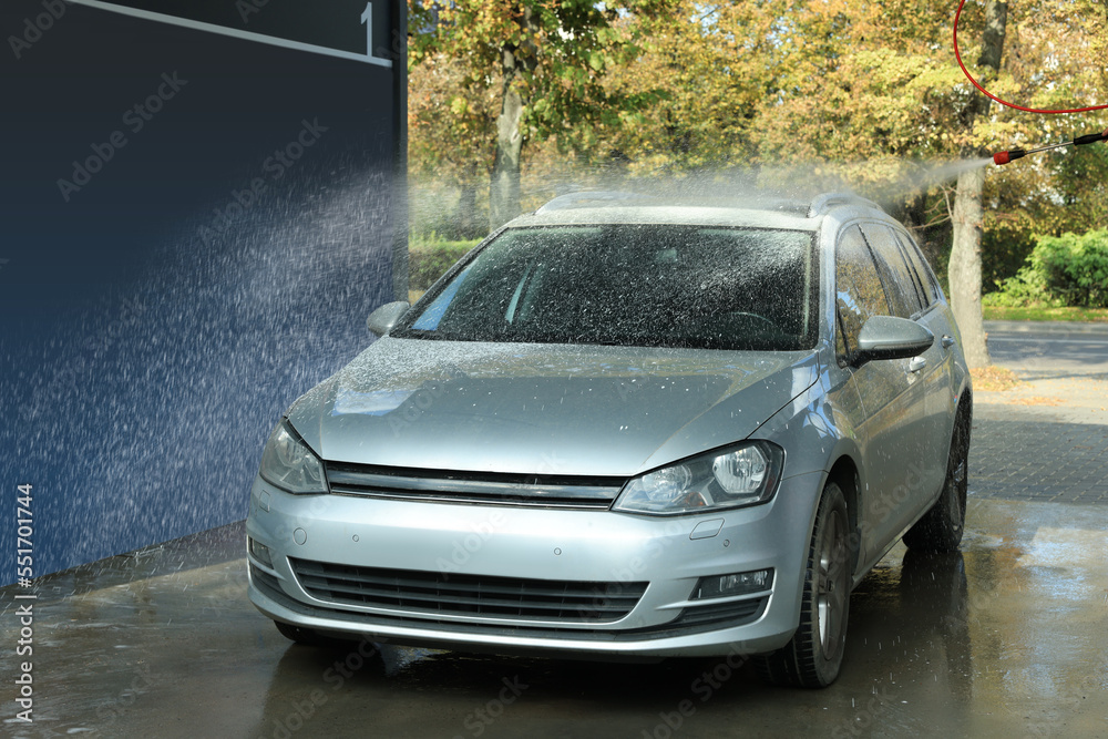 Washing auto with high pressure water jet at outdoor car wash Stock ...